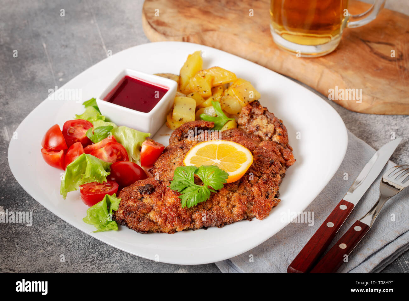 Viennese schnitzel with salad Stock Photo - Alamy