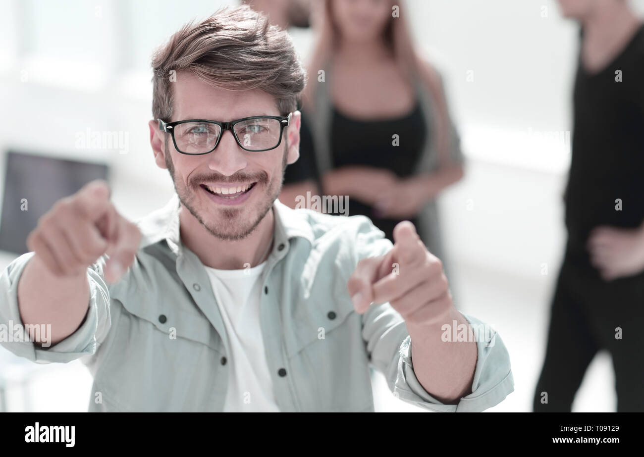 Smiling man pointing his finger to you Stock Photo - Alamy