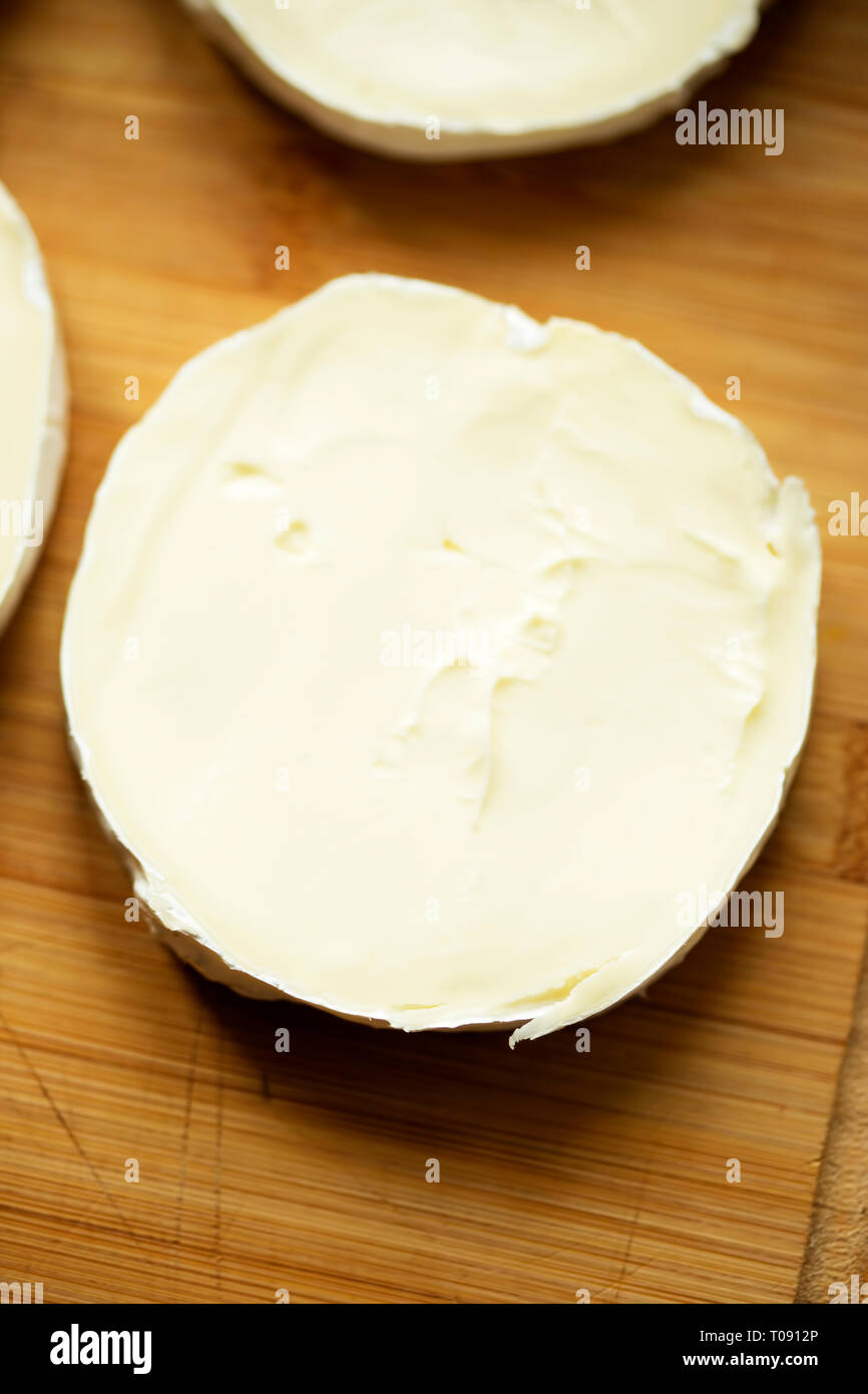 Cut brie cheese Stock Photo - Alamy