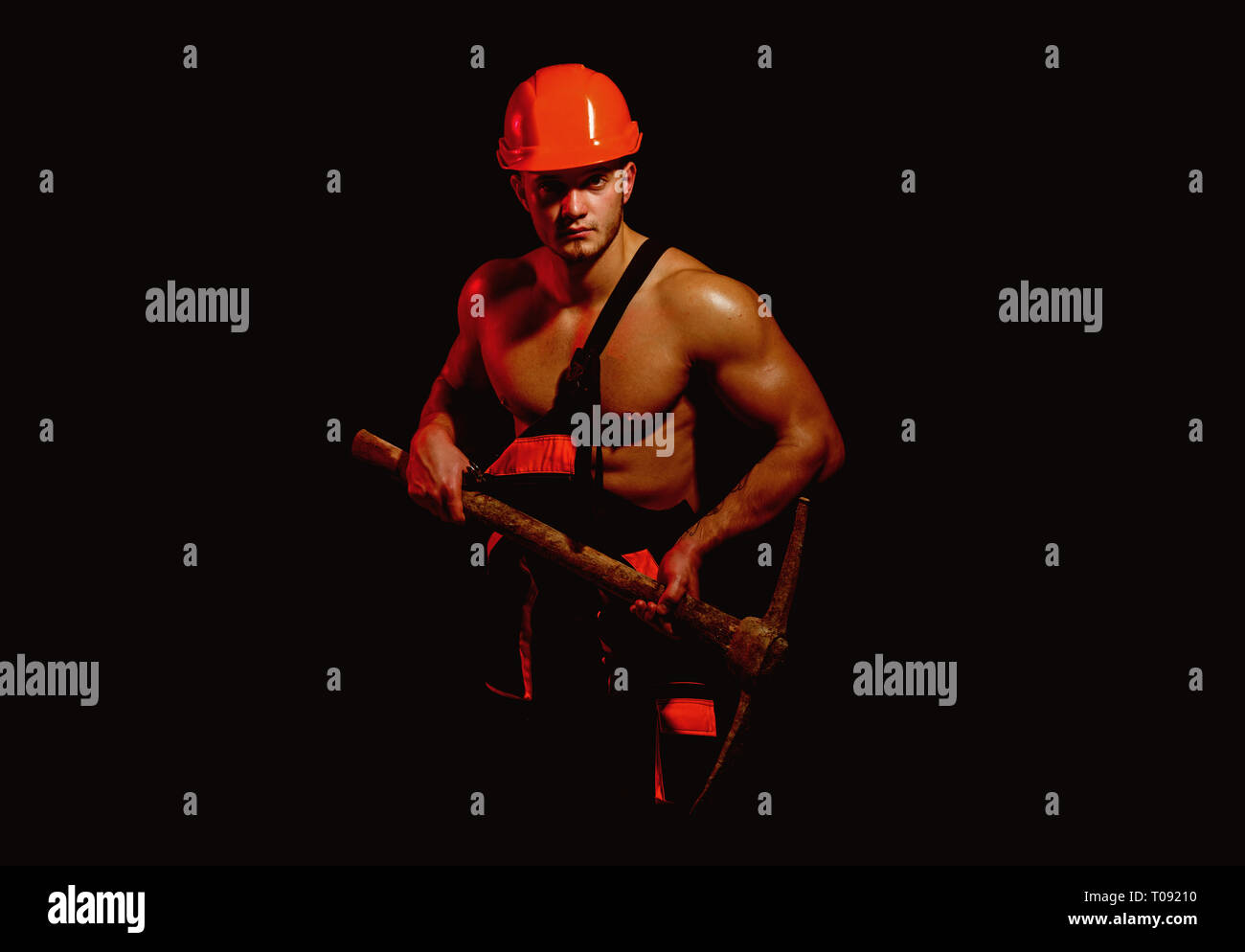 Mining area under construction. Muscular man worker. Hard worker with ...