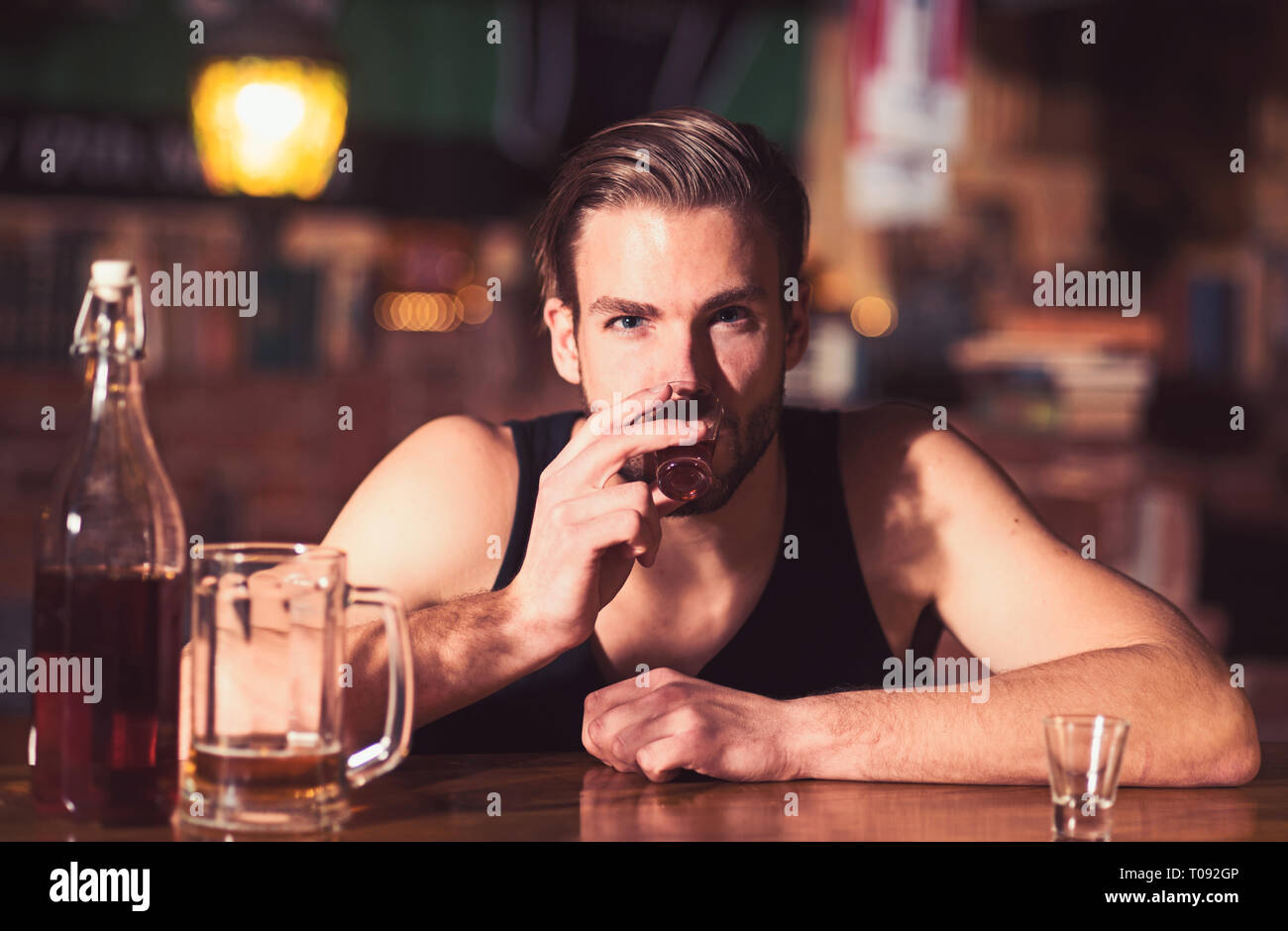 A regular alcohol drinking. Alcohol addict with short alcohol drink ...