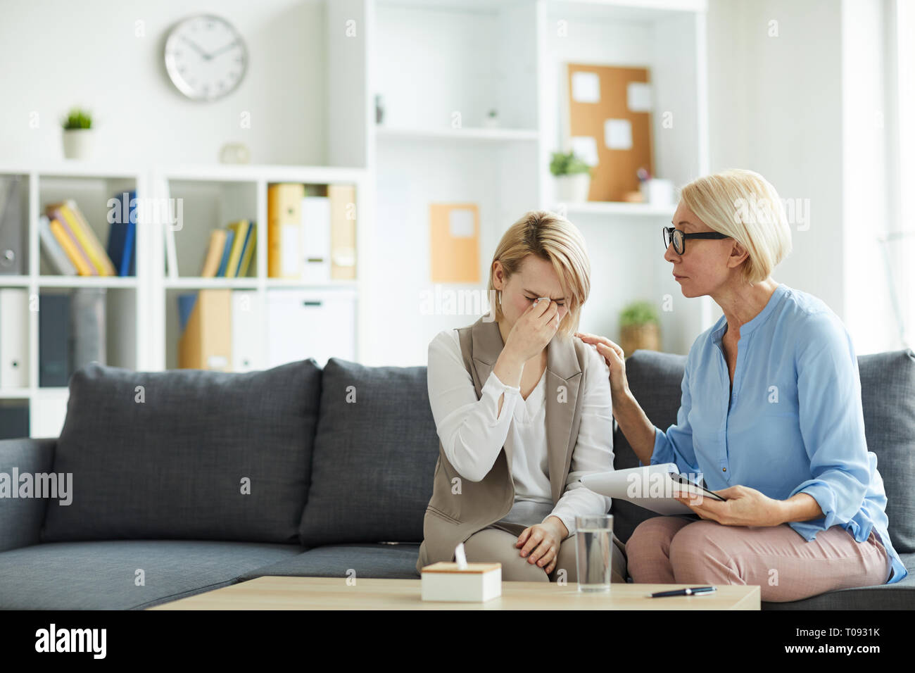 Comforting crying patient Stock Photo - Alamy