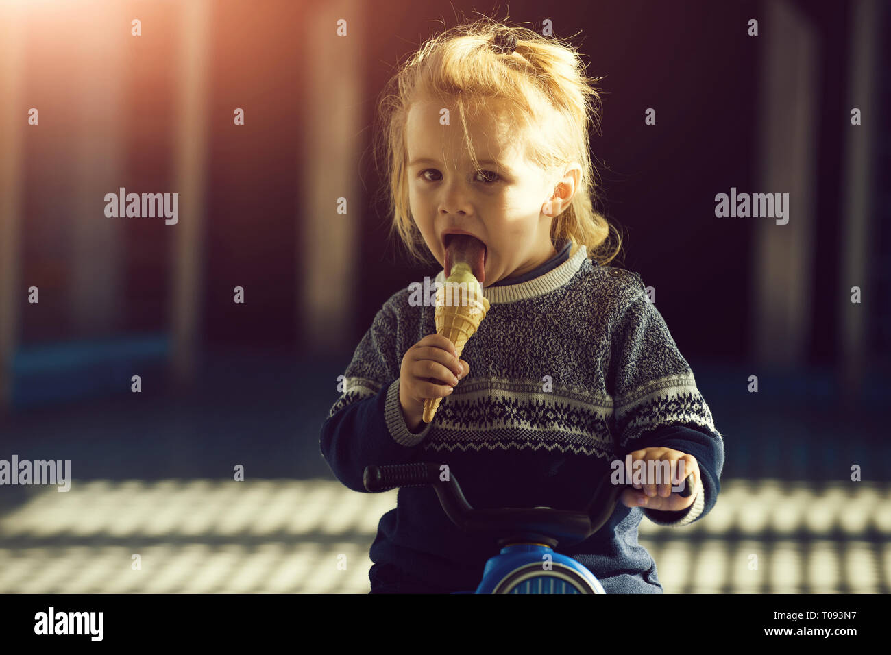 Cute blonde boy eating ice hi-res stock photography and images - Alamy