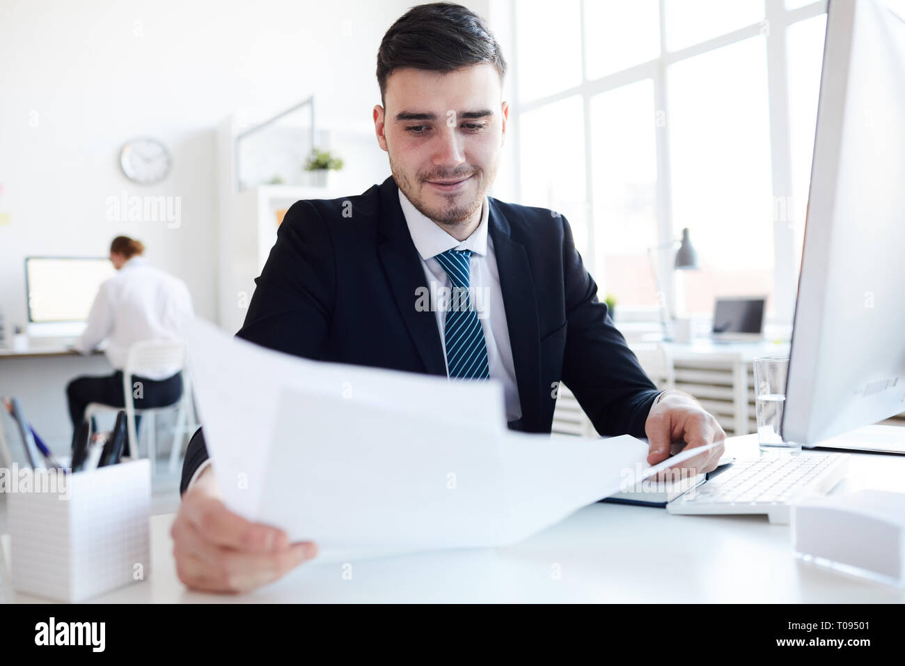 Young banker at work Stock Photo - Alamy