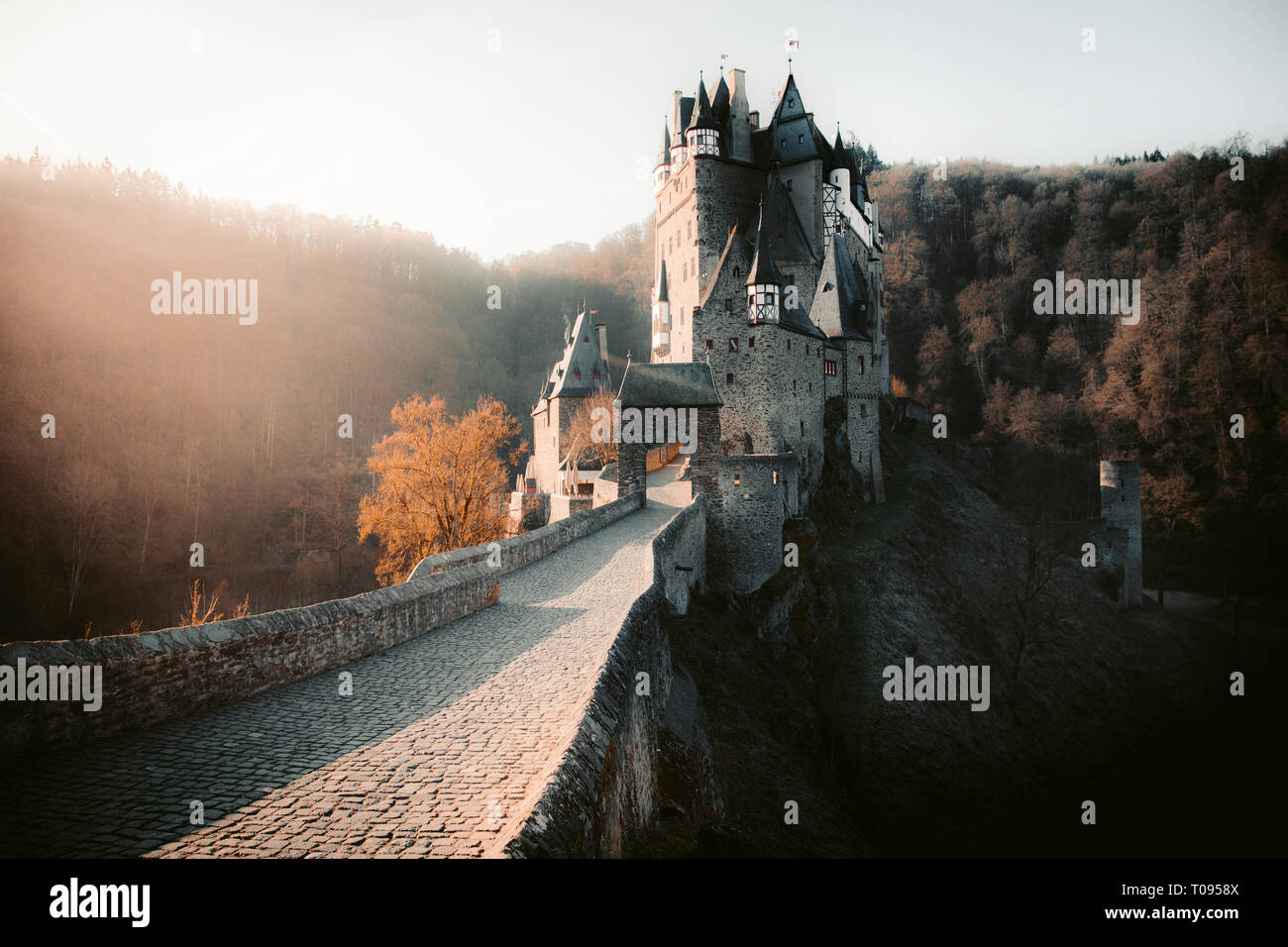 Beautiful view of famous Eltz Castle in scenic golden morning light at ...