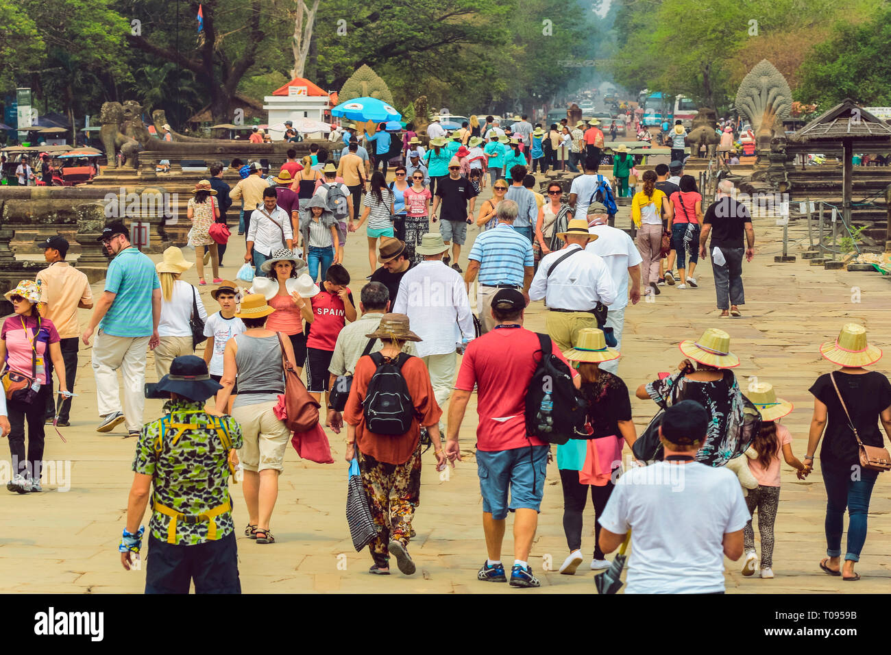 Tourist crowds exit from western causeway to the famous 12th Century ...
