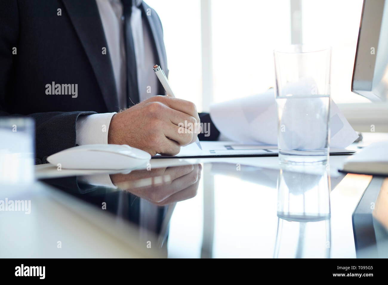 Young man working financial documents hi-res stock photography and ...