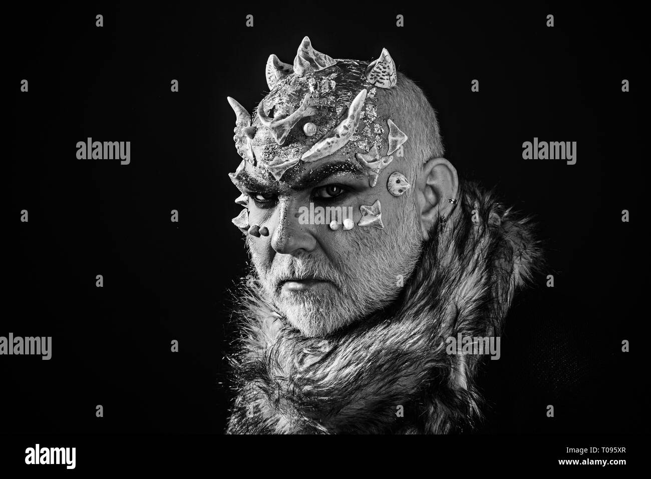 Alien, demon, sorcerer makeup. Senior man with white beard dressed like ...