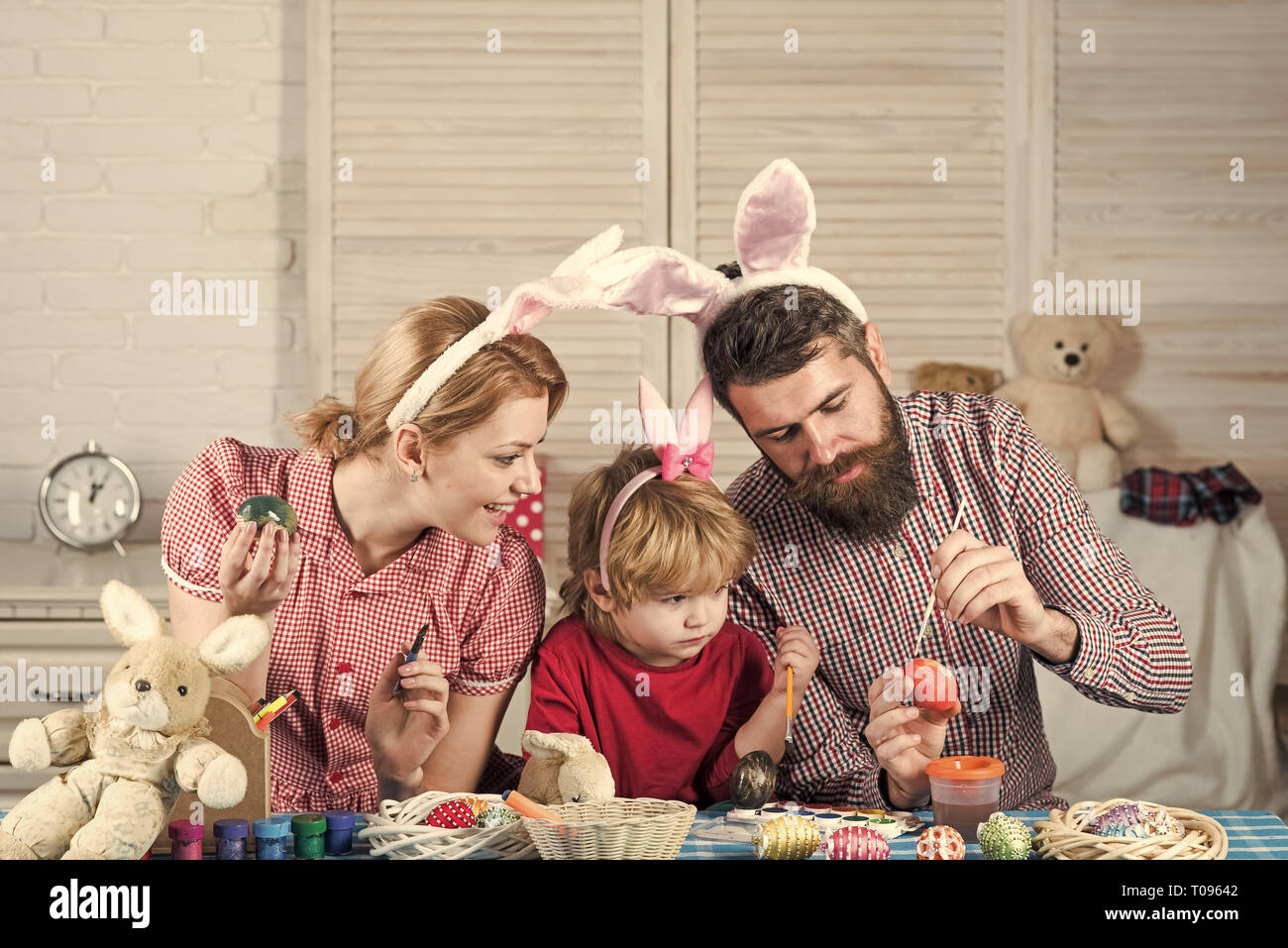 painting and drawing easter eggs with family Stock Photo - Alamy
