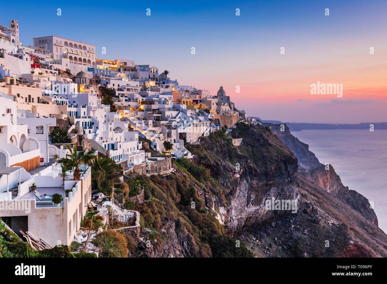 Santorini, Greece. The picturesque Fira village at sunset Stock Photo ...