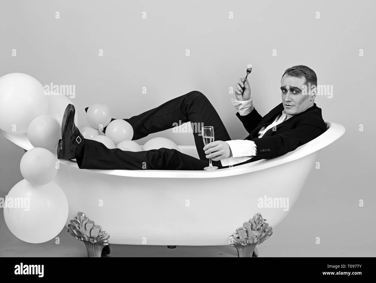 I am celebrating. Mime actor enjoy bathing in bath tub. Bathing and ...