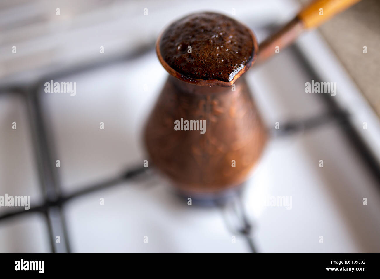 Very hot ready coffee hat - Coffee brewed in a copper cezve on a gas ...