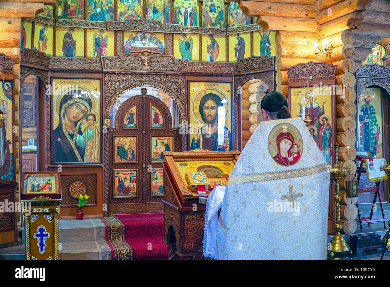 The priest is behind the lectern Stock Photo - Alamy