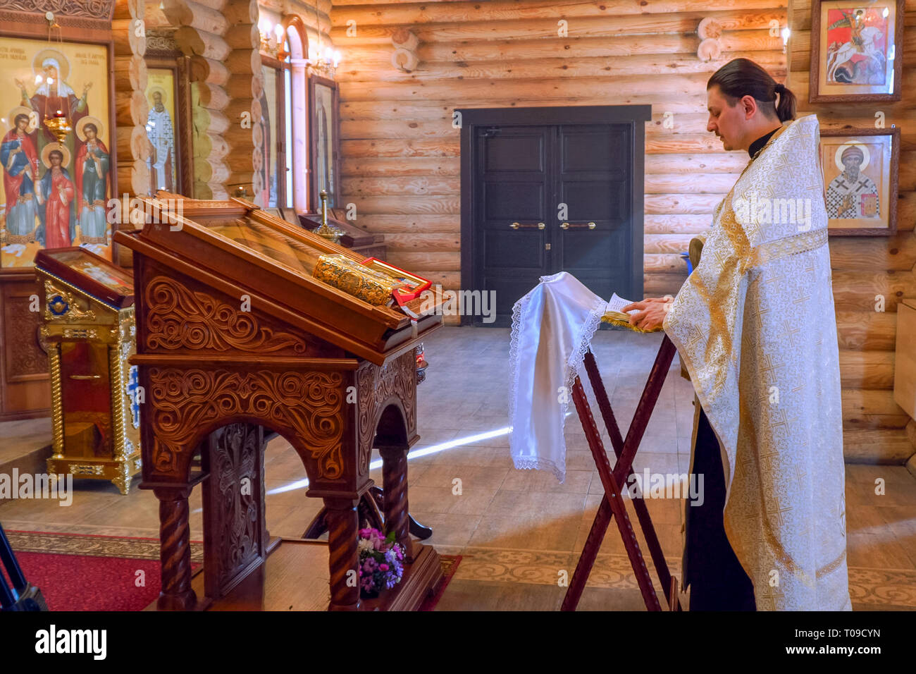 The priest is behind the lectern Stock Photo - Alamy