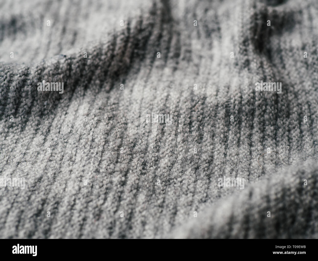 Gray sweater fabric texture. Clothes sweater background with folds ...