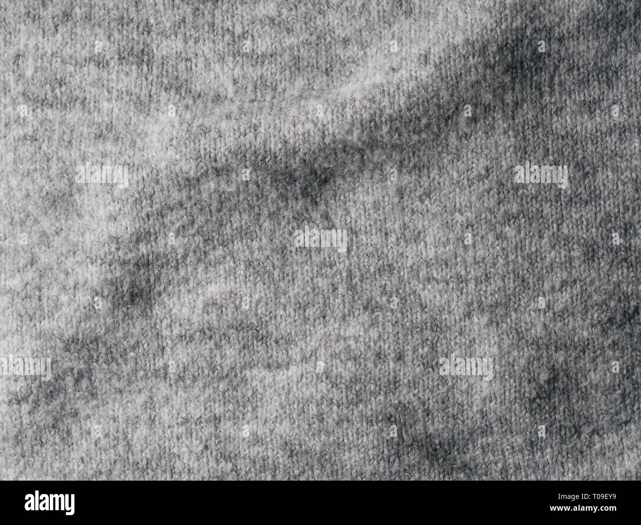 Gray sweater fabric texture. Clothes sweater background with folds ...