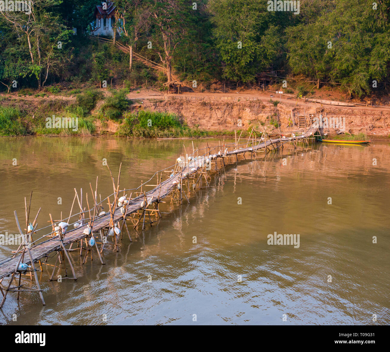 Bamboo cane bridge over Nam Kahn river tributary of Mekong, Luang ...