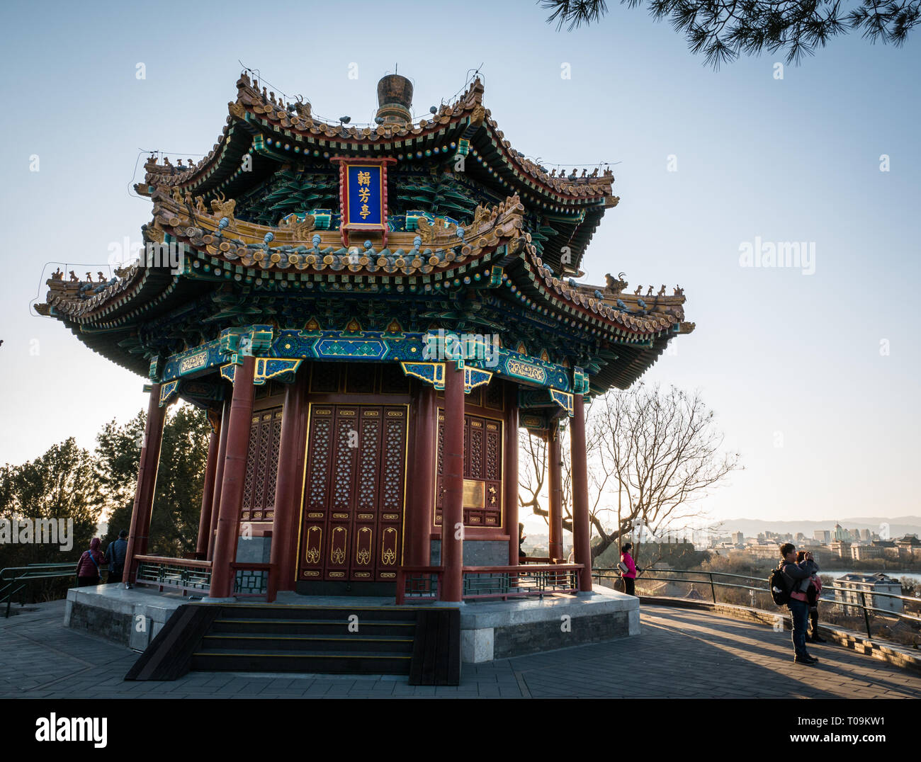 Classical red Chinese pavilion with colorful ornaments with view on ...