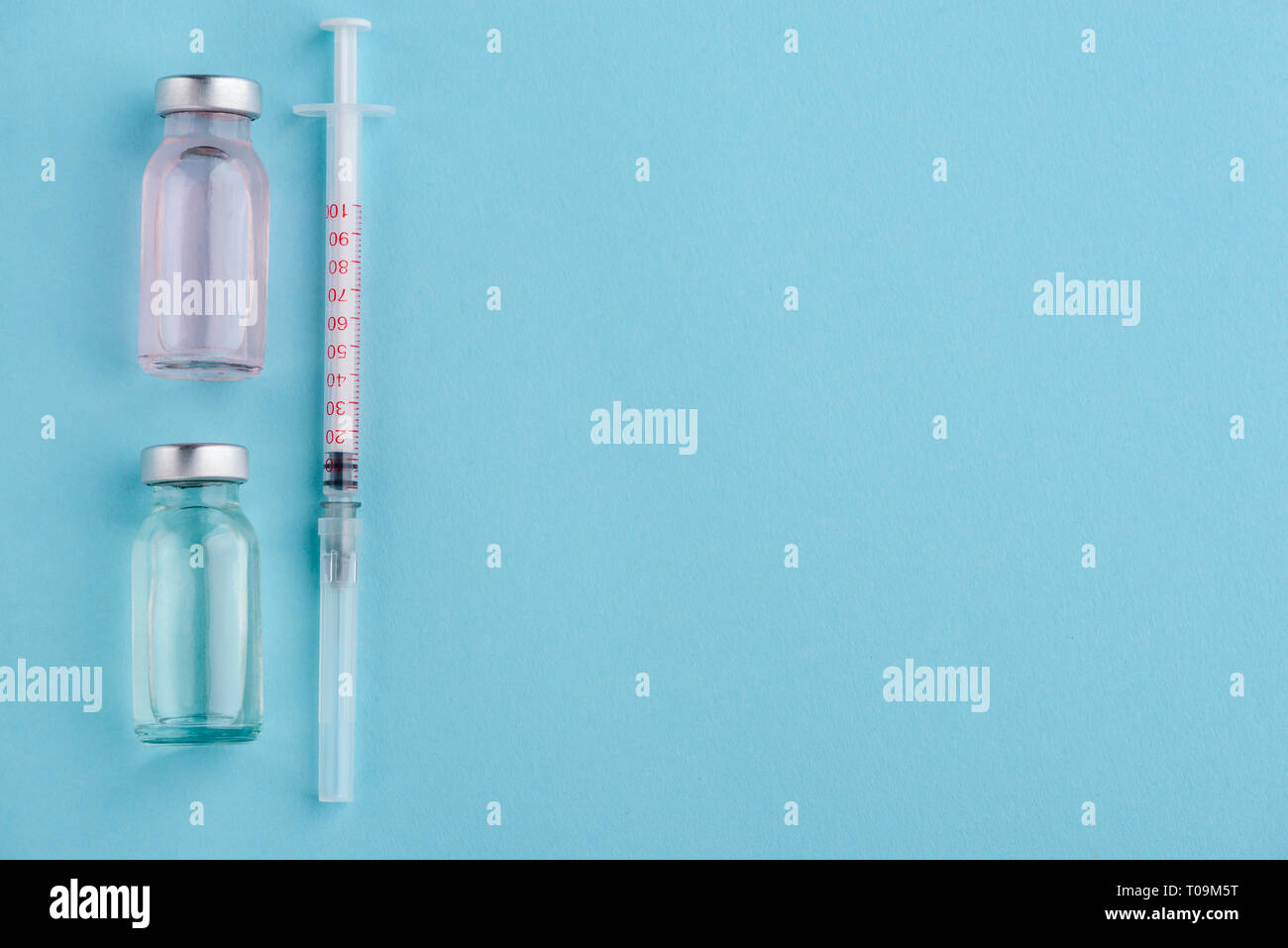 Two vials and syringe Stock Photo - Alamy
