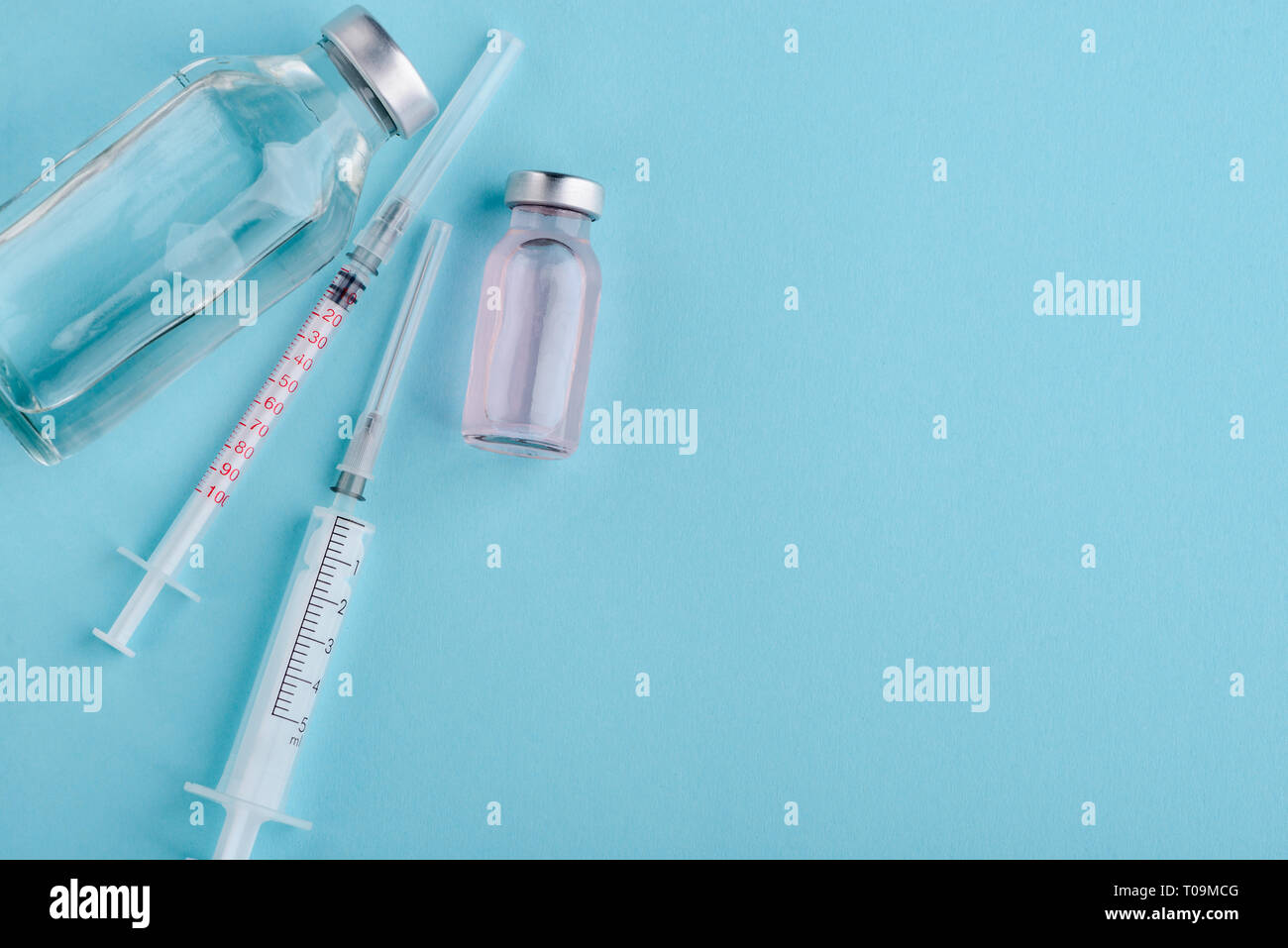 Saline, syringes and vial Stock Photo - Alamy