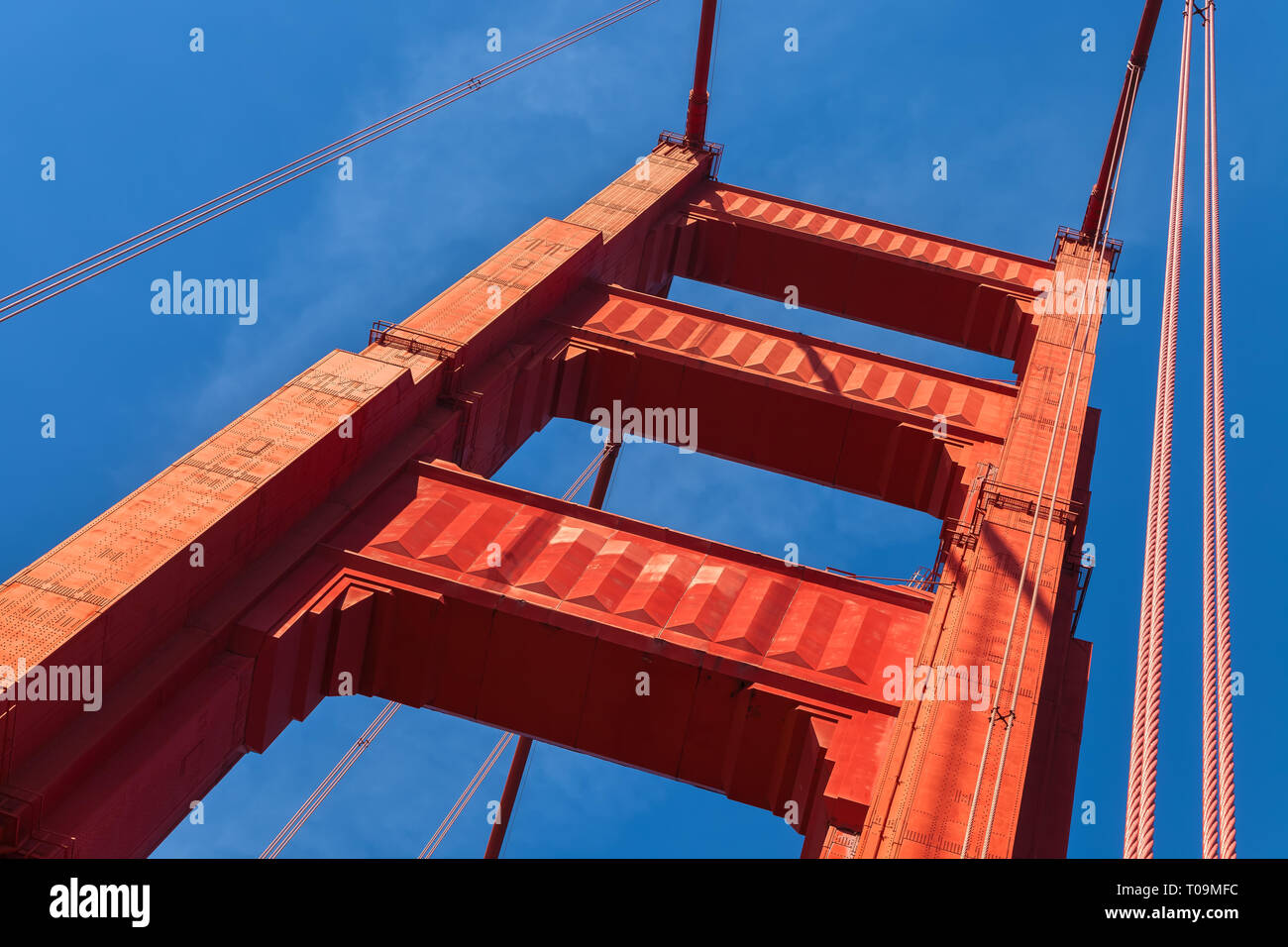 Low camera angle shot at the tower structure of the Golden Gate Bridge ...
