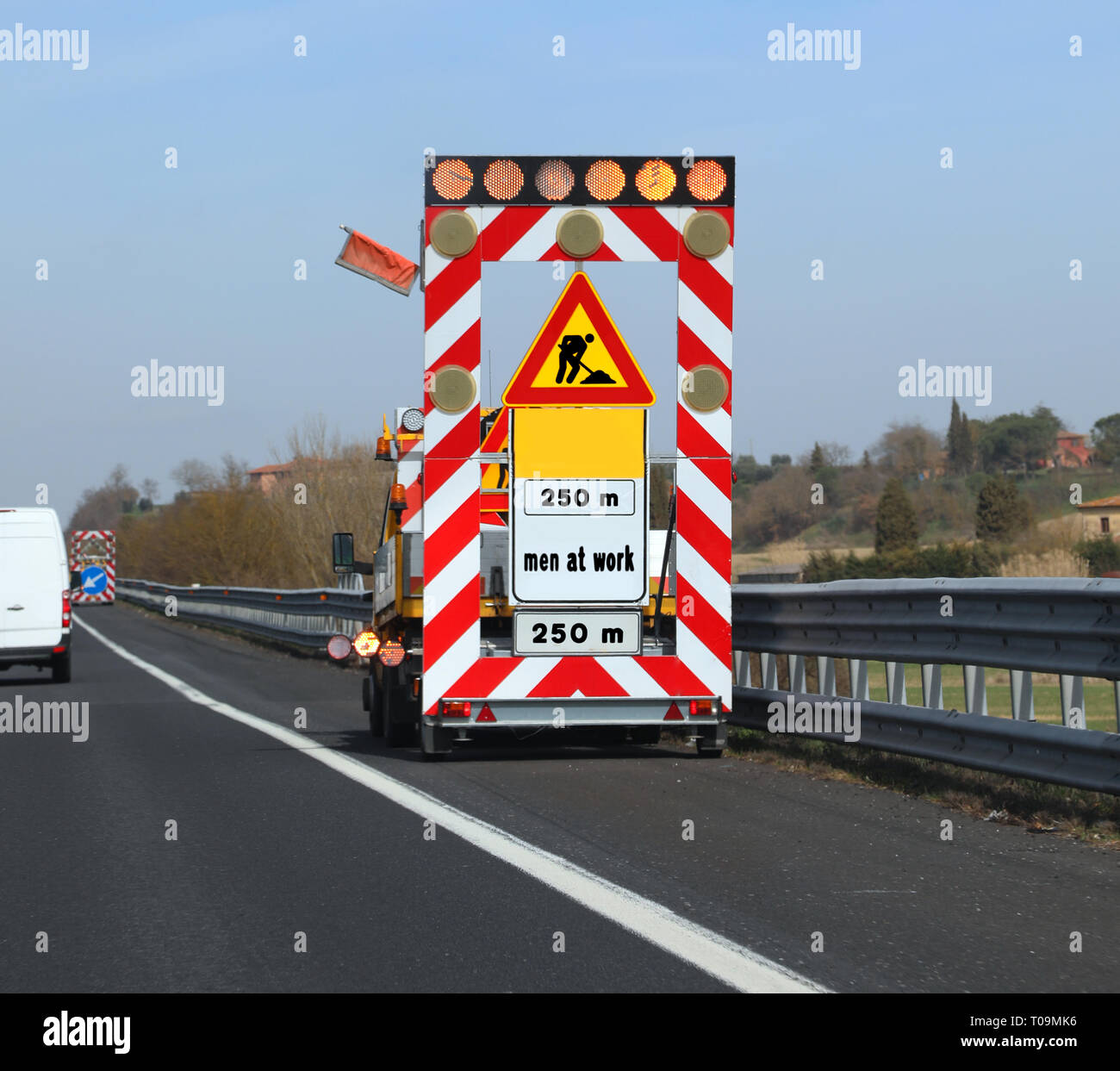 Slow down men work sign hi-res stock photography and images - Alamy