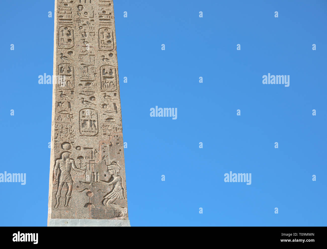 Ancient Egyptian obelisk with many symbols called hieroglyphics that ...