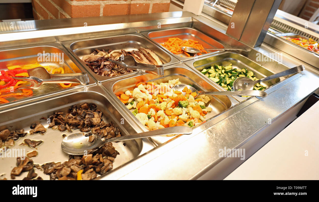 self service restaurant with many raw and cooked foods Stock Photo - Alamy
