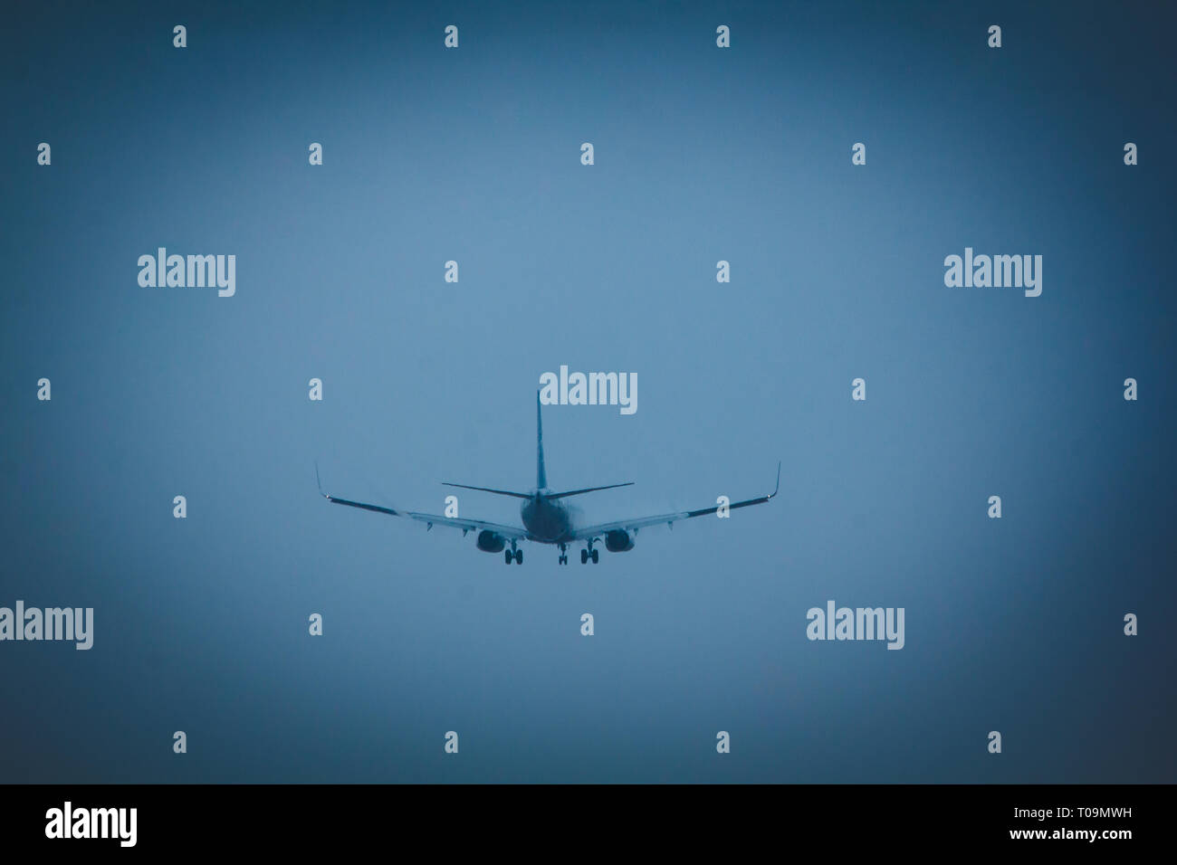 Airplane in the sky during the rain. The plane flies in the sky ...