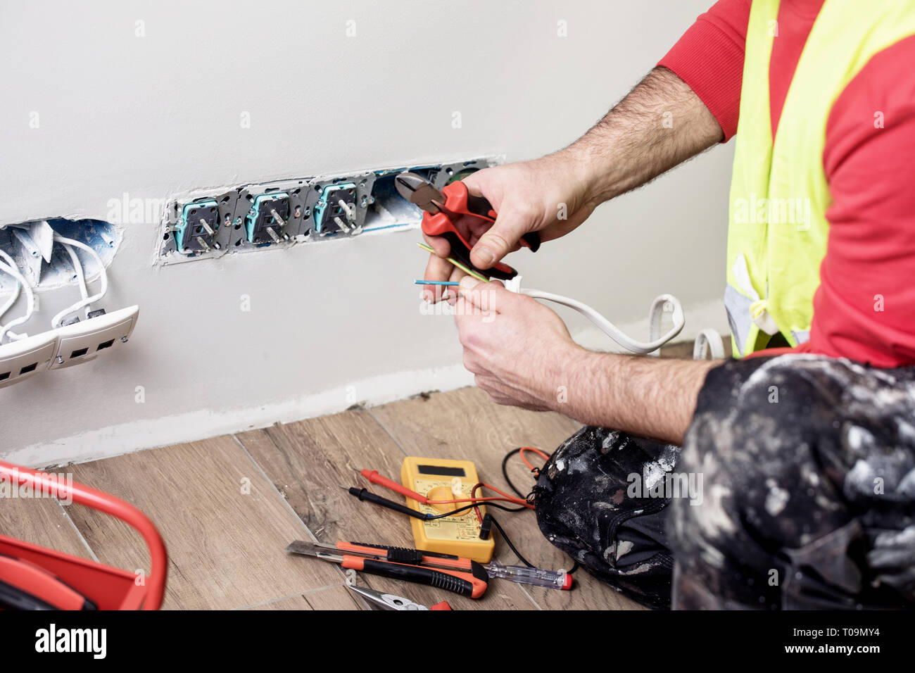 Electrician Hands Installing Wall Socket Stock Photo - Alamy