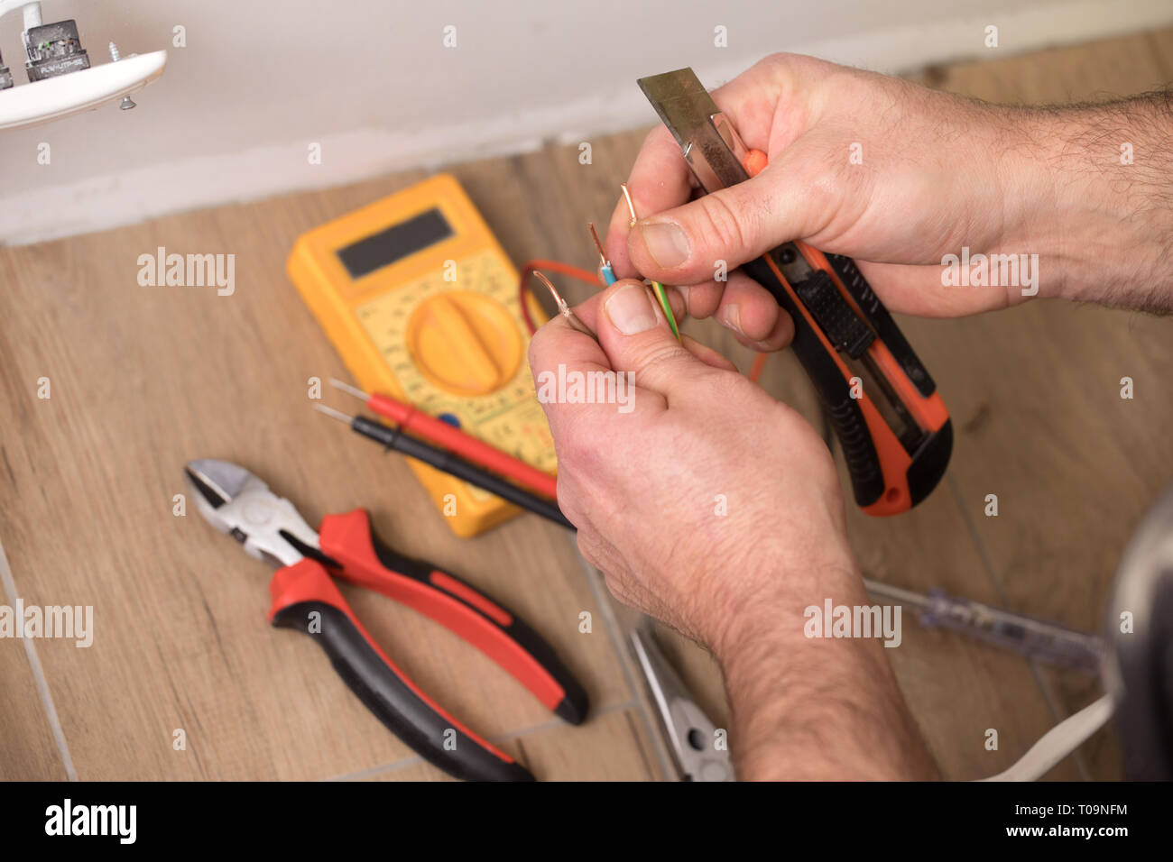 Electrician Hands Installing Wall Socket Stock Photo - Alamy
