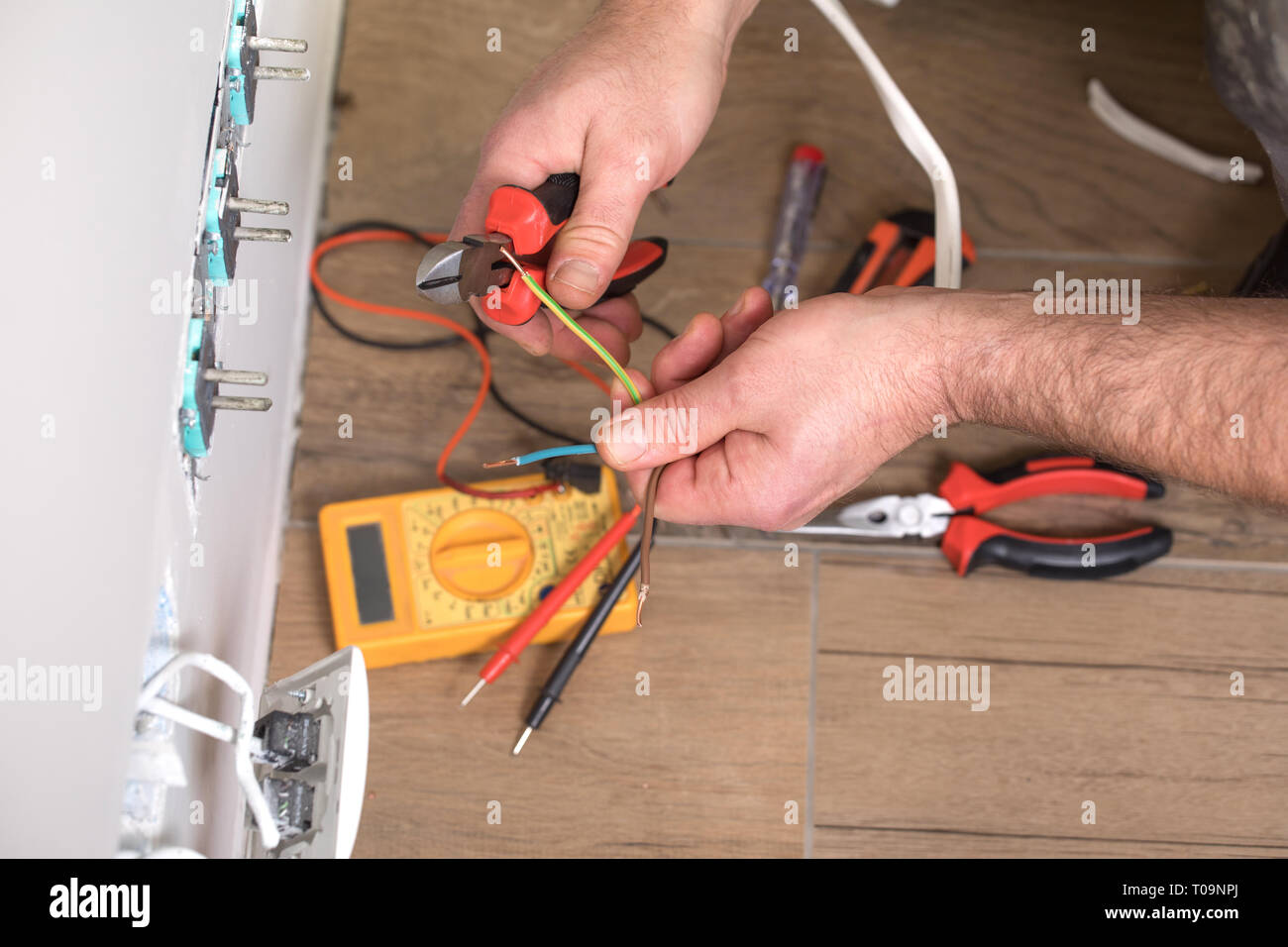 Electrician Hands Installing Wall Socket Stock Photo - Alamy