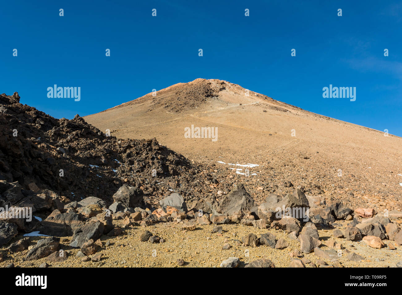 Majestic volcanic cone rising above spectacular lava shaped landscape ...