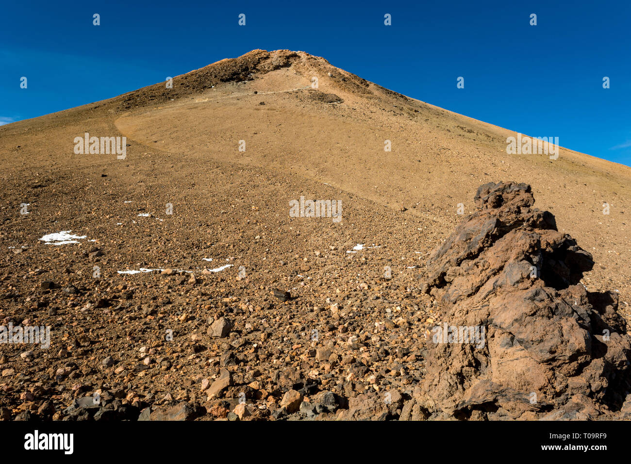 Majestic volcanic cone rising above spectacular lava shaped landscape ...
