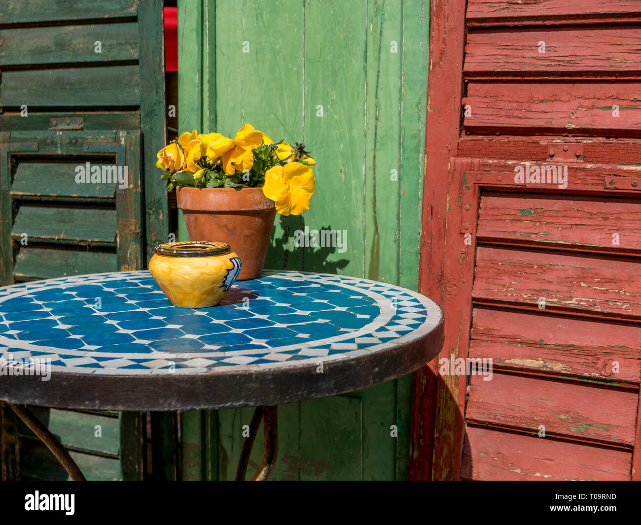 Mosaic table with old colorful wooden window hatches Stock Photo - Alamy