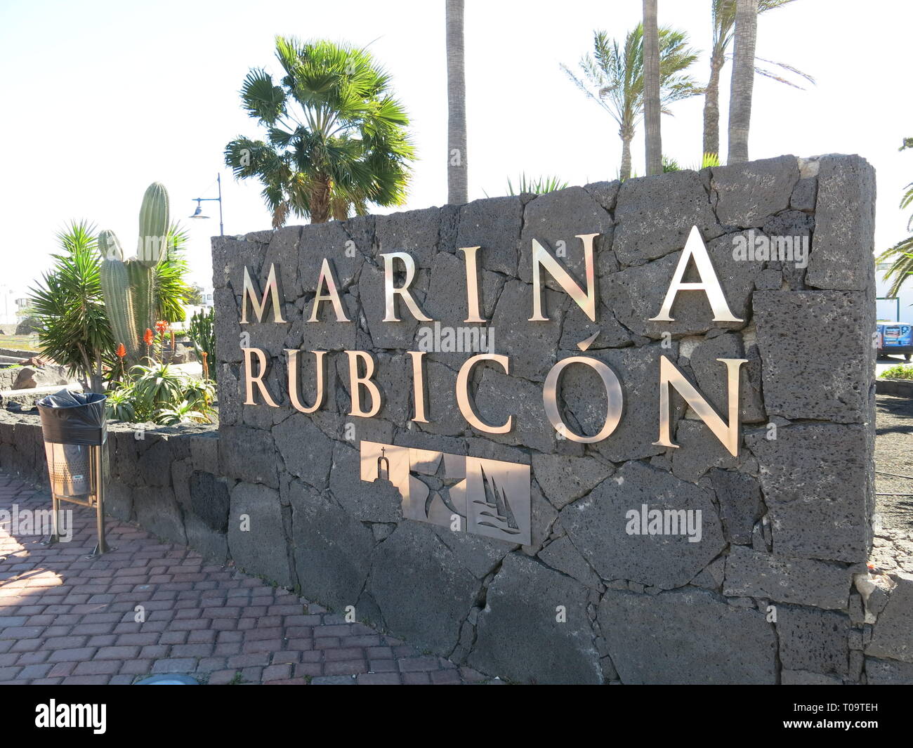 A grey rock wall with "MARINA RUBICON" in large lettering indicates the ...