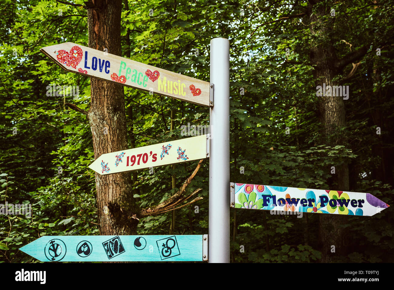 signpost with vintage messages from sixties and seventies Stock Photo ...