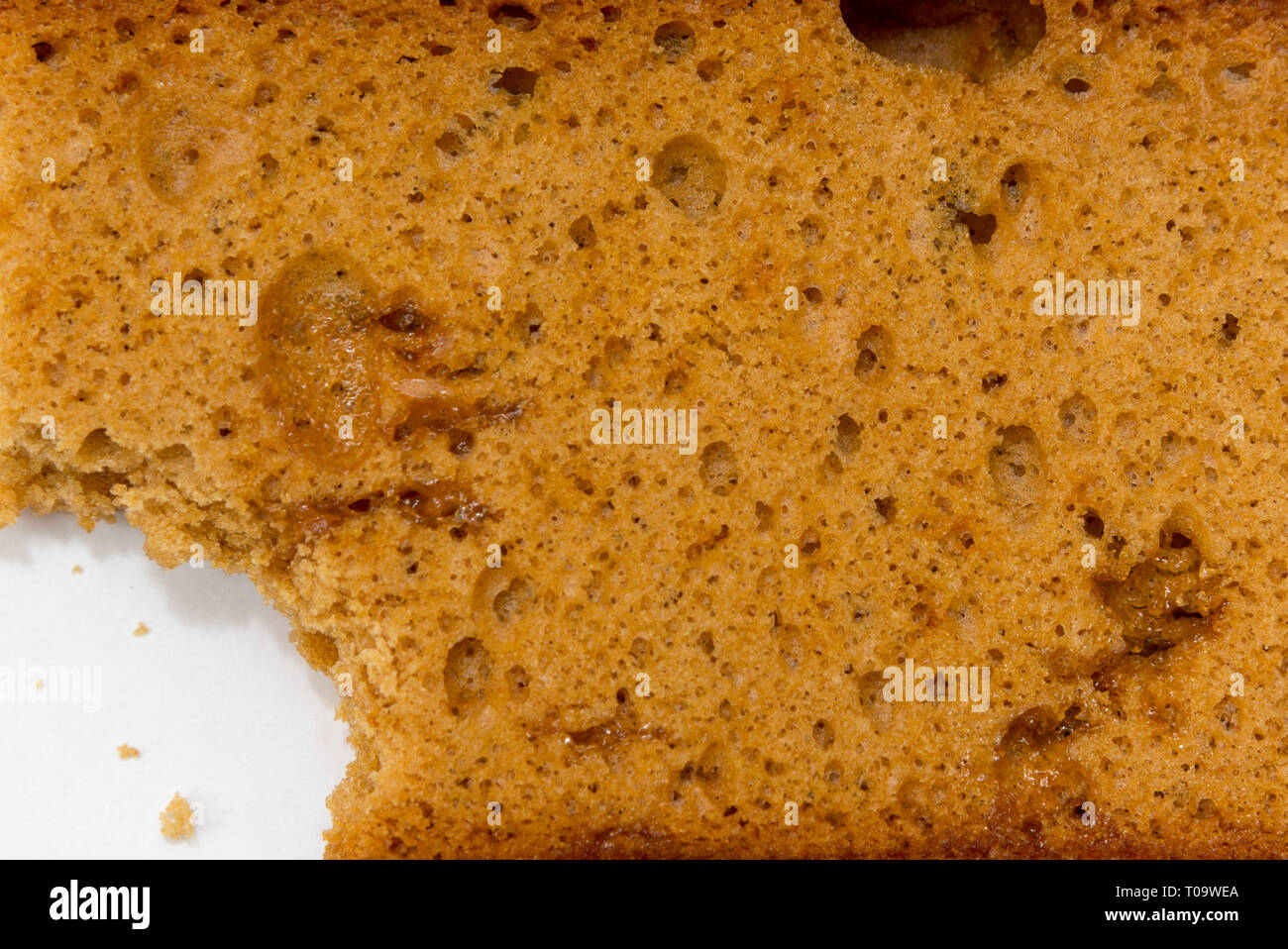 gingerbread with piece bitten of on white background Stock Photo - Alamy