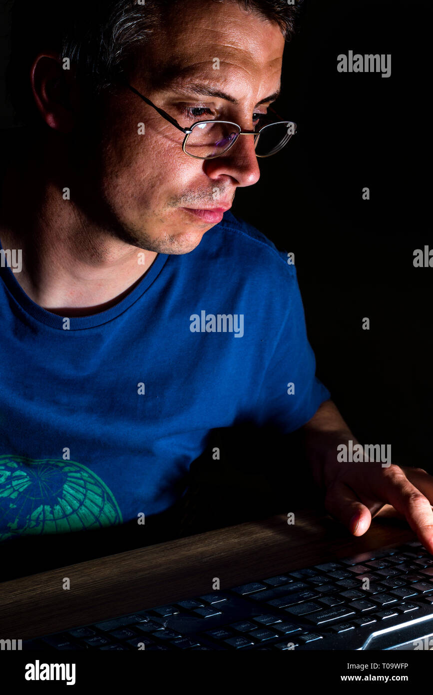 man late at night still working on computer Stock Photo - Alamy