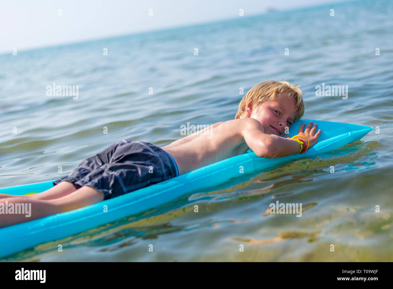 Boy with inflatable hi-res stock photography and images - Alamy