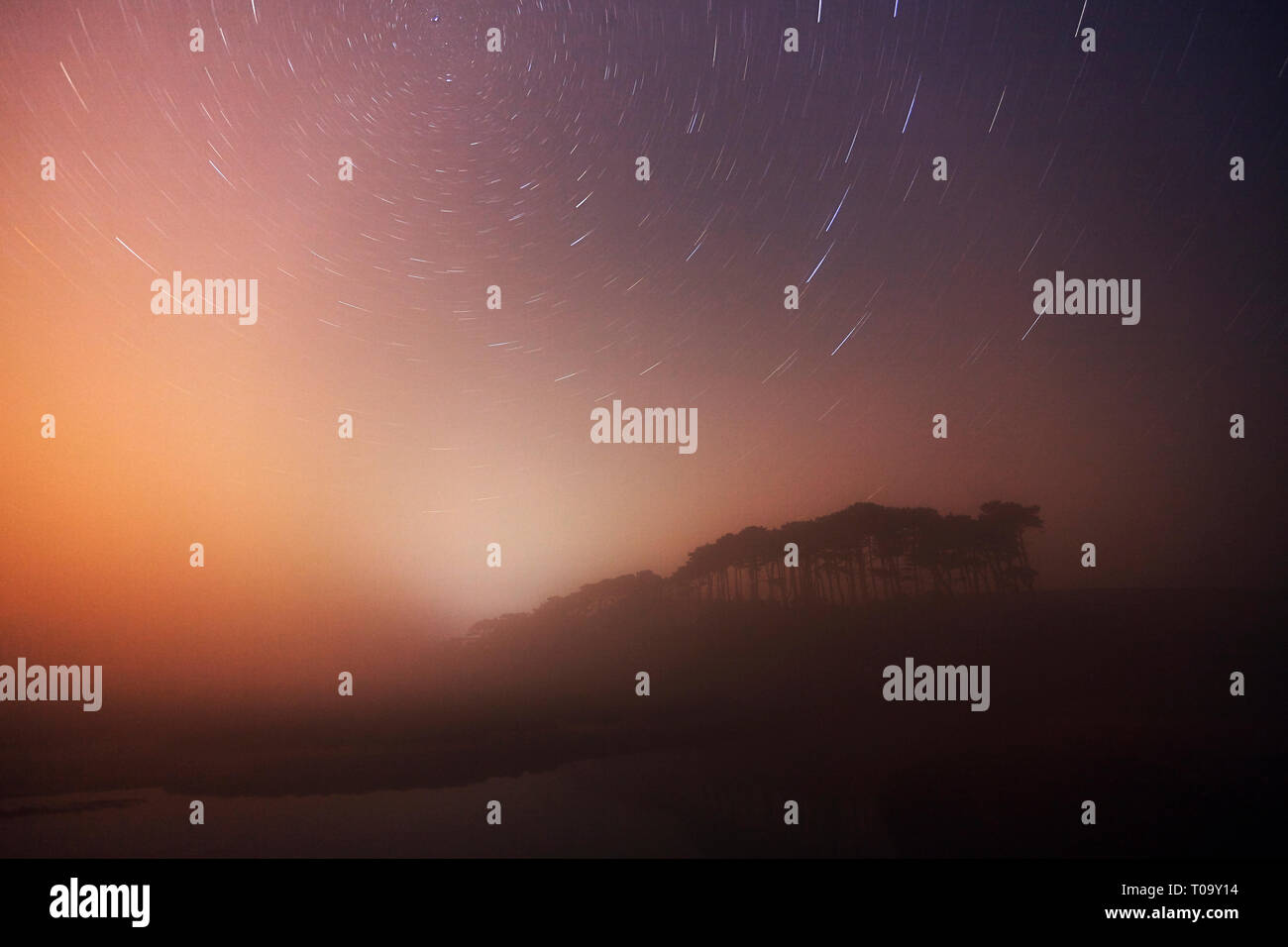 A night sky, showing stars rotating around the Pole Star, over the ...