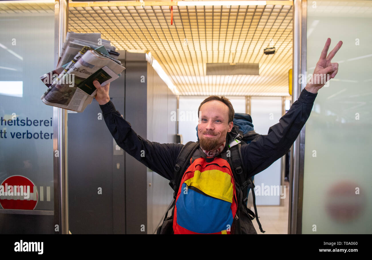 Berlin, Germany. 18th Mar, 2019. The German journalist Billy Six raises ...