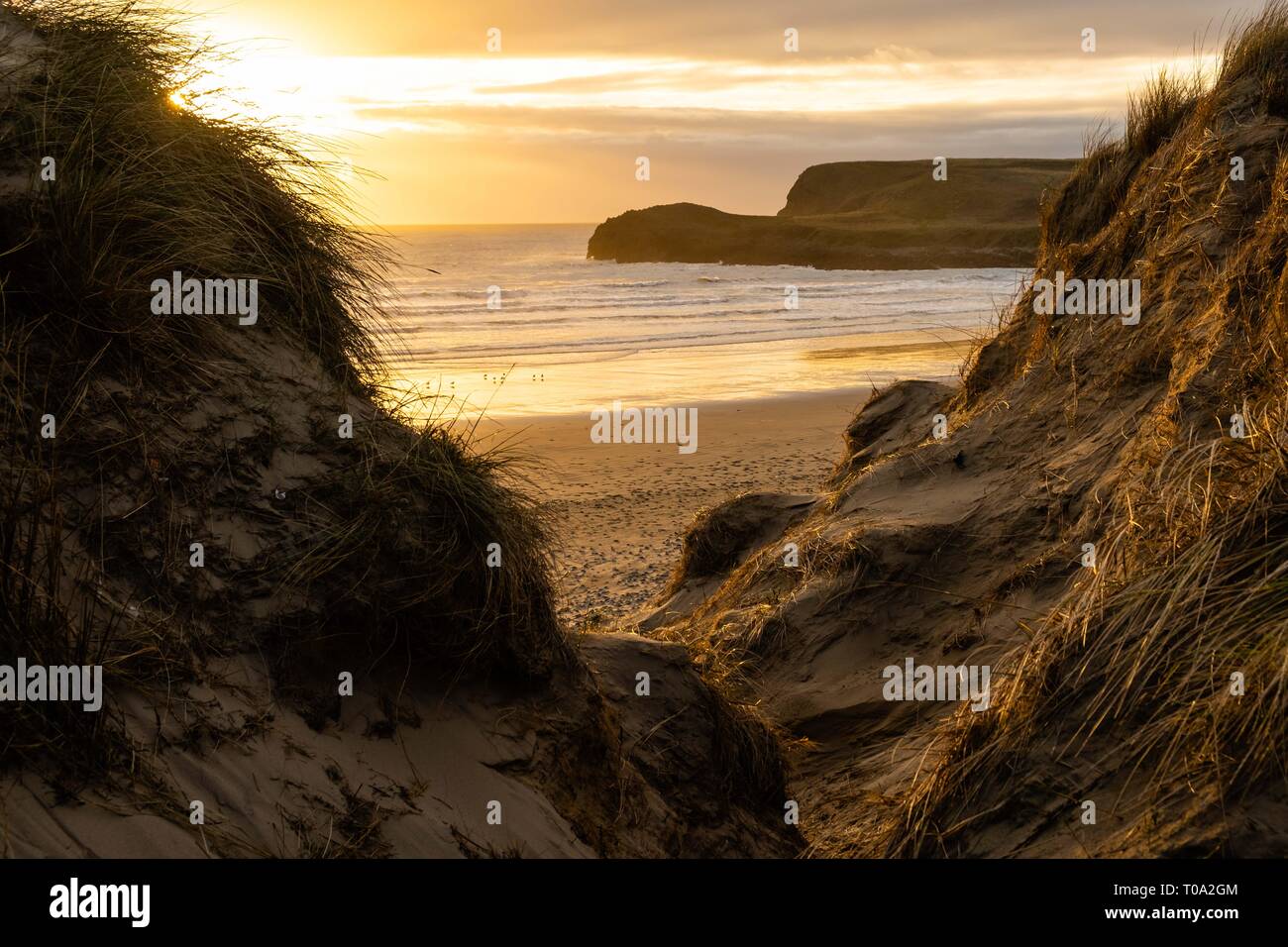 Gower, Swansea, Wales, UK. 18th March, 2019. A sunset over the tidal ...