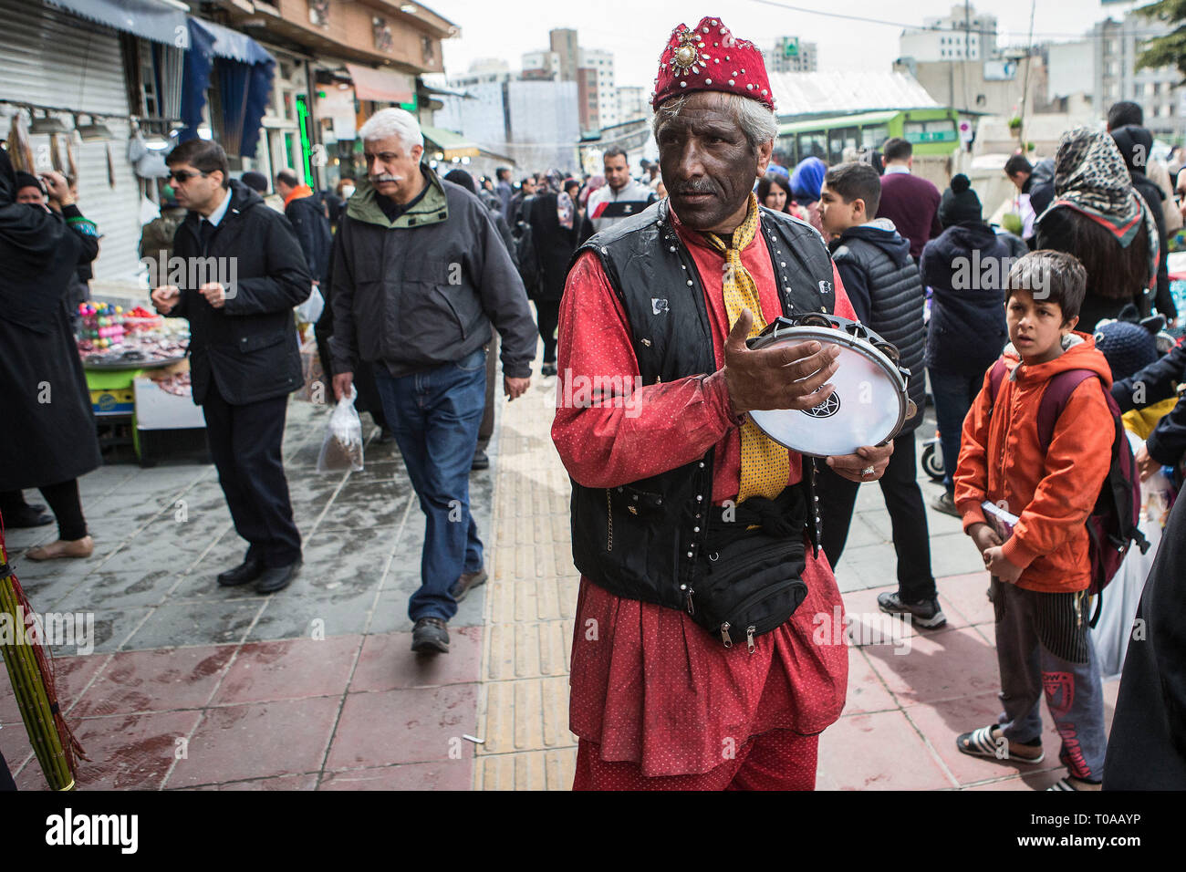 Tehran. 18th Mar, 2019. A man (C) dressed as a Haji Firouz, a ...