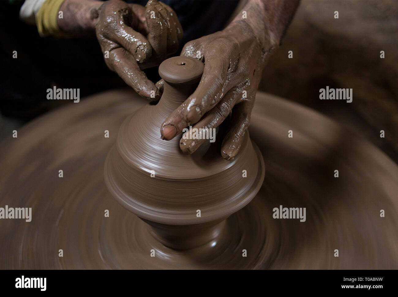 Srinagar, Indian-controlled Kashmir. 19th Mar, 2019. A potter makes ...