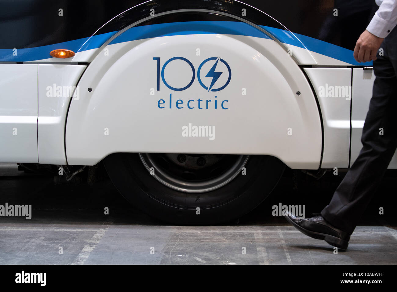 Berlin, Germany. 19th Mar, 2019. A visitor of the fair Bus2Bus passes ...