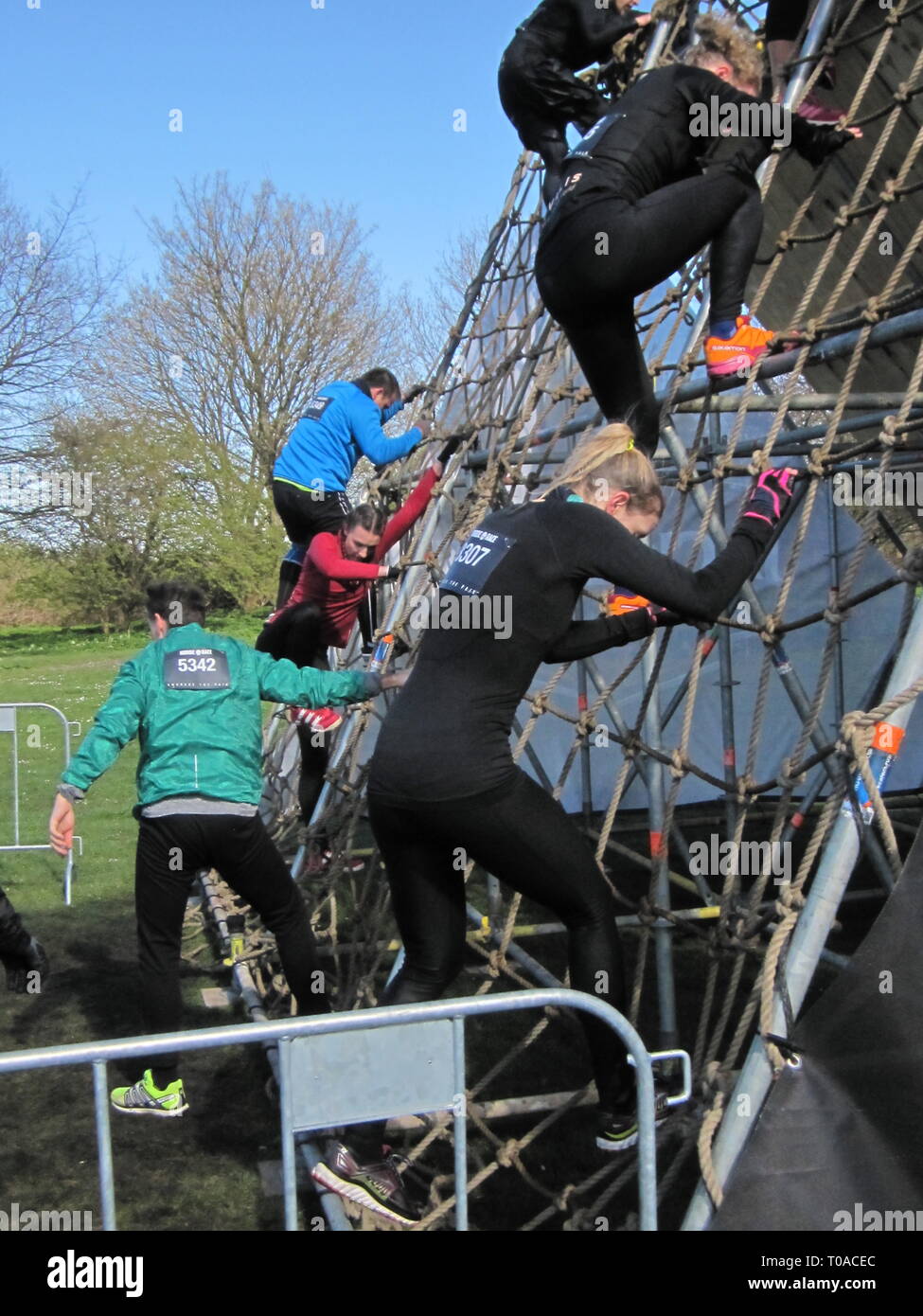 Active people during extreme obstacle course in boot camp Stock Photo ...
