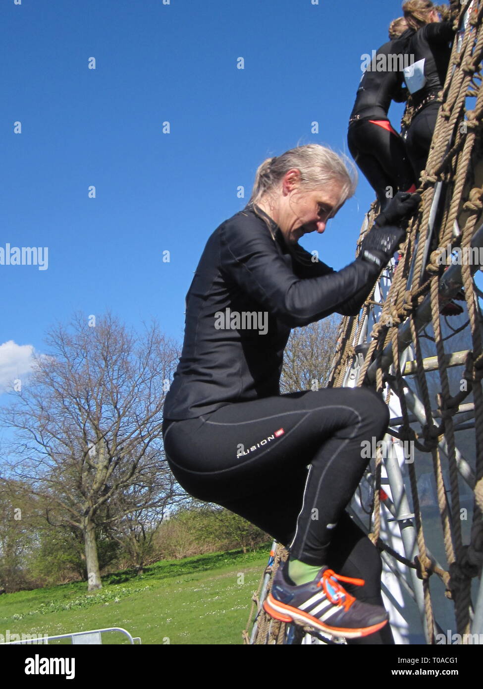 Active people during extreme obstacle course in boot camp Stock Photo ...