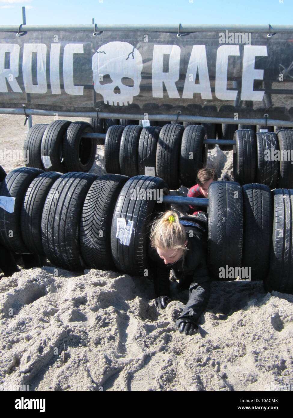 Active people during extreme obstacle course in boot camp Stock Photo ...