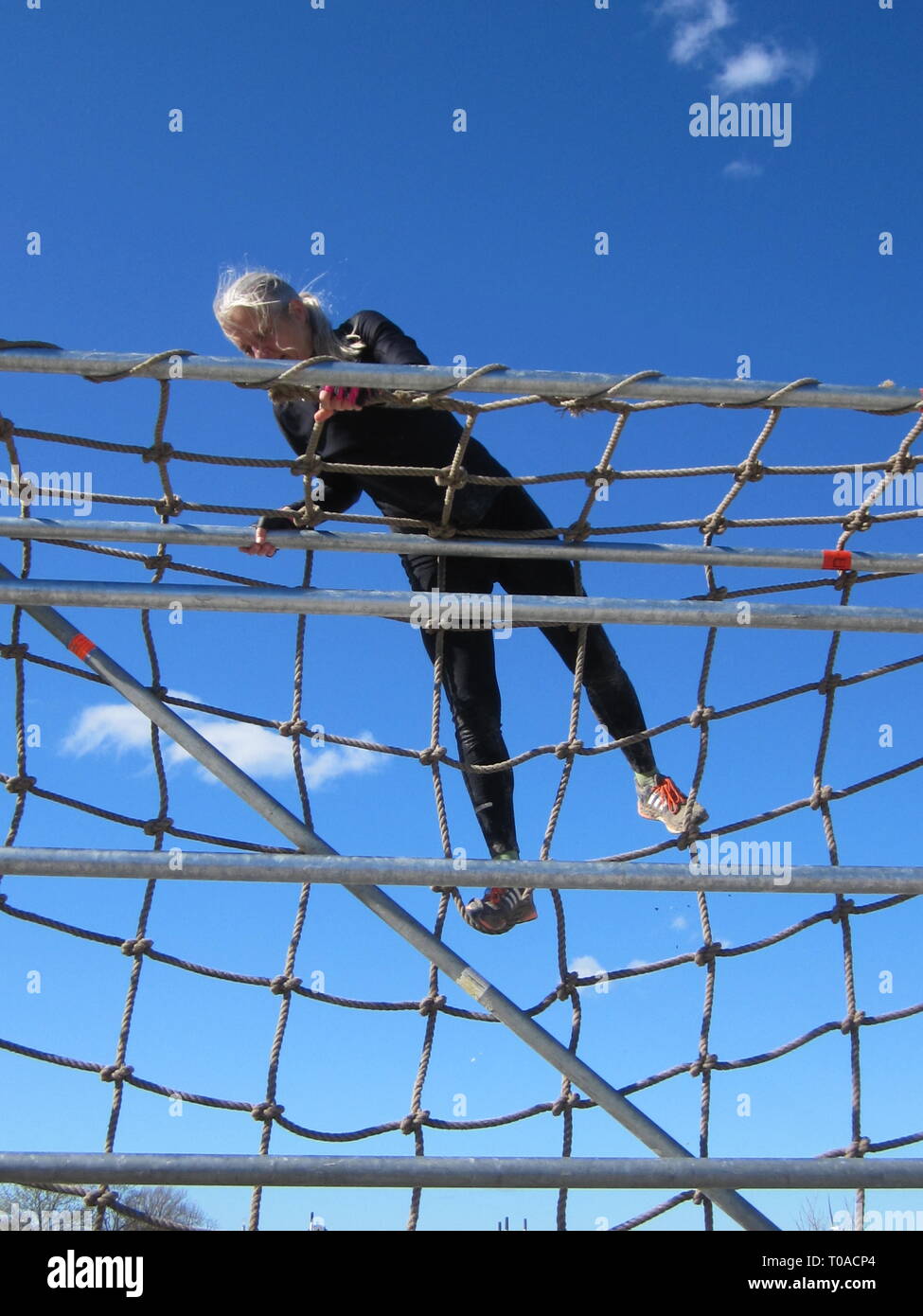 Active people during extreme obstacle course in boot camp Stock Photo ...